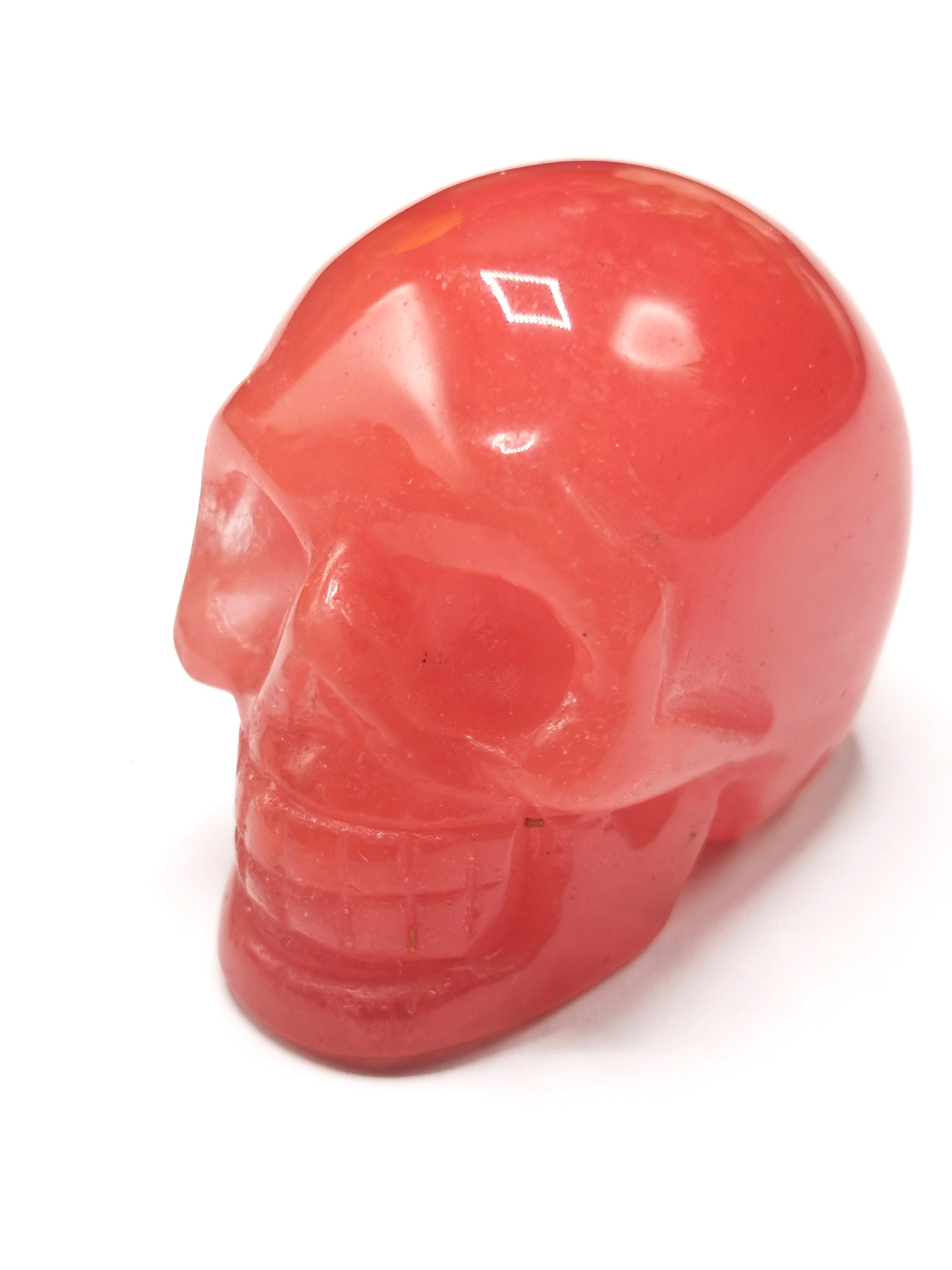 Hand carved skull in red melting stone stone - crystal crafts | Home D