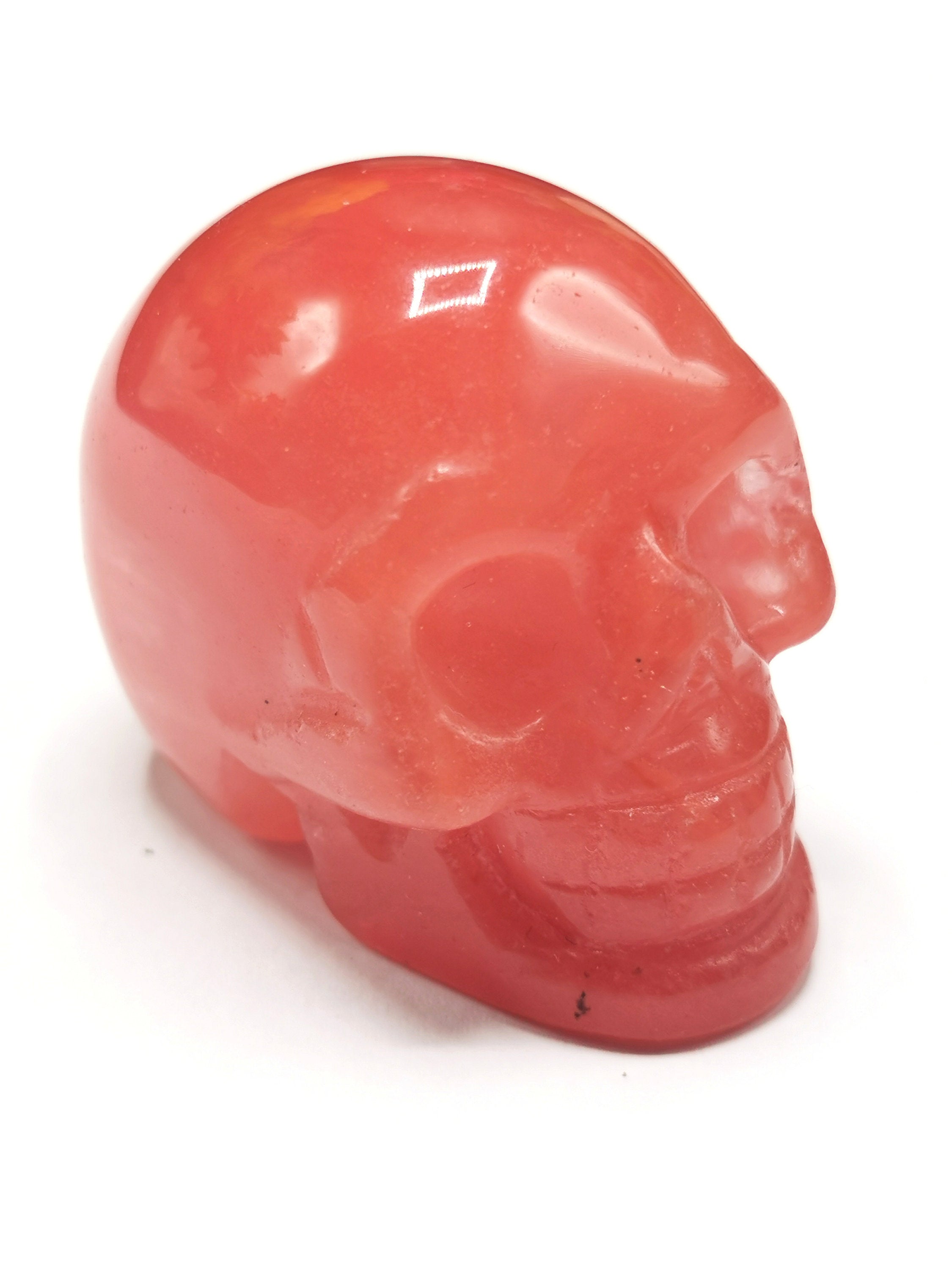 Hand carved skull in red melting stone stone - crystal crafts | Home D